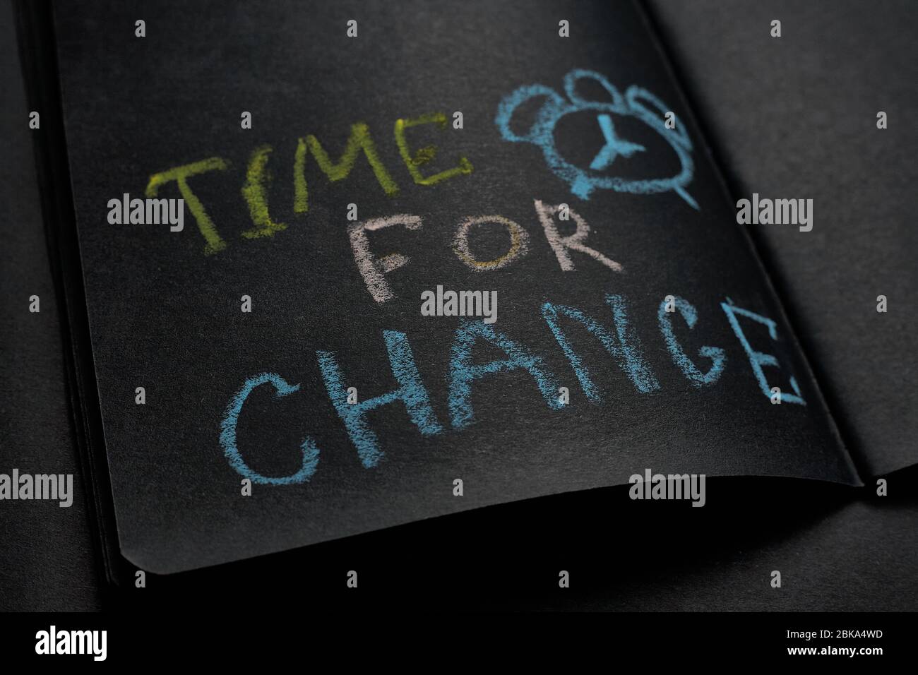Time for a change. Handwritten concept in a black notebook. Business ...