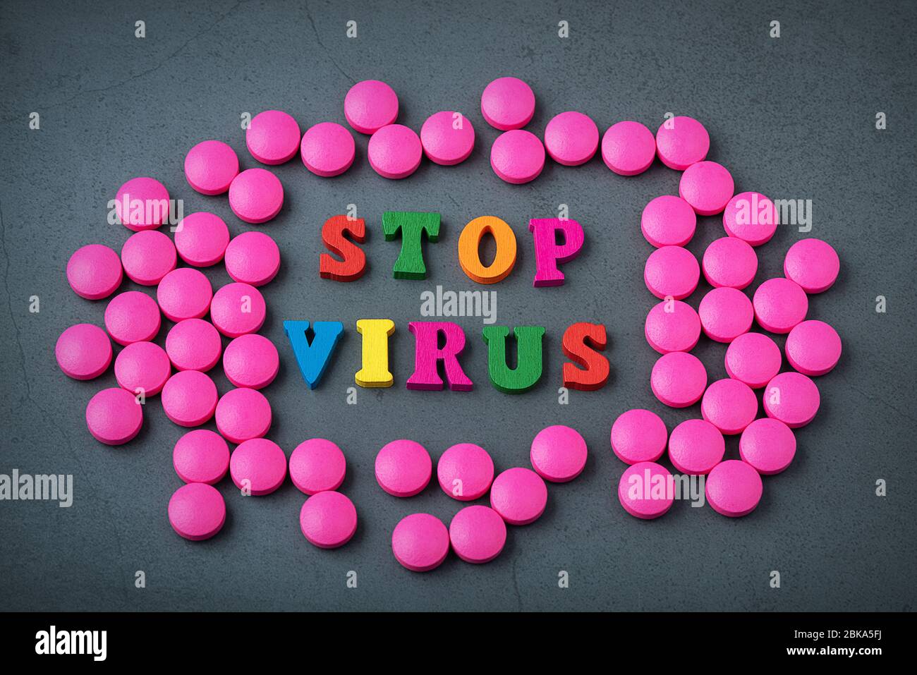 The stop sign consists of multicolored letters in a frame of bright ...