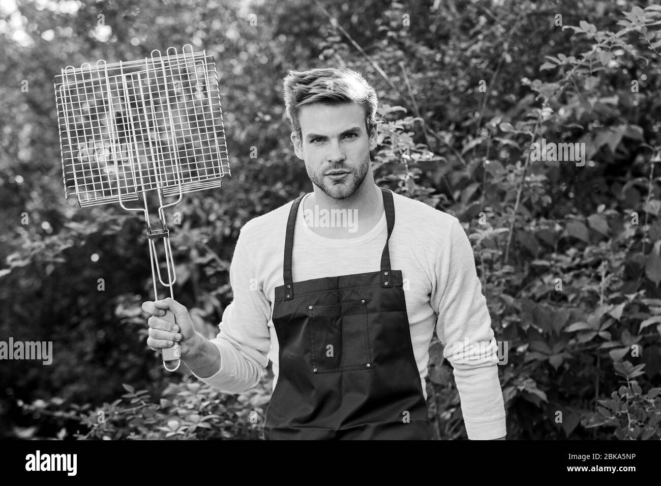 Different methods grilling beef chicken vegetables and seafood. Man ...