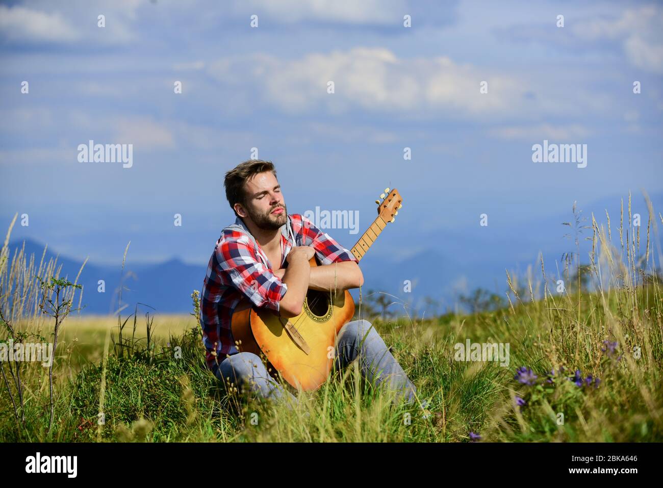 United with nature. Musician looking for inspiration. Dreamy wanderer ...