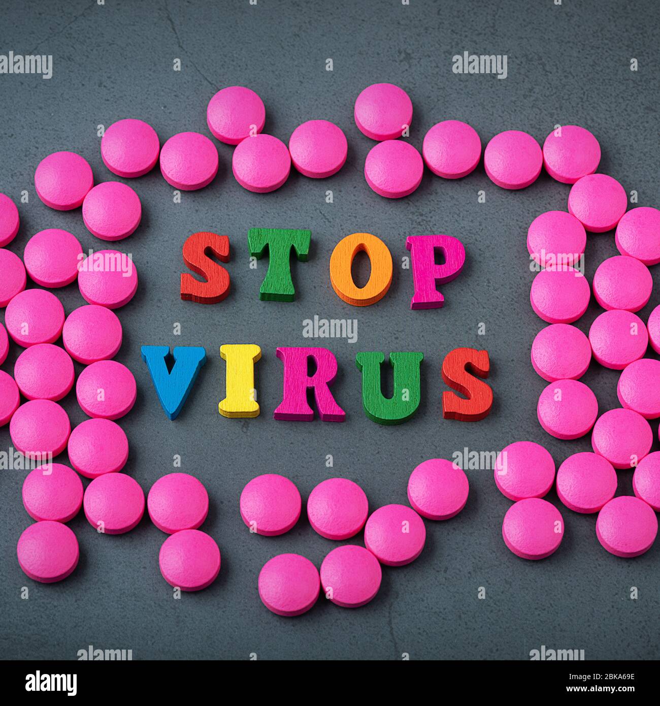 The stop sign consists of multicolored letters in a frame of bright ...