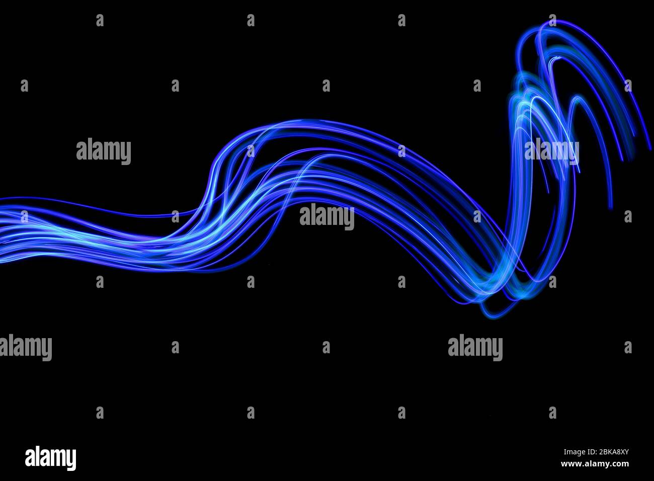 Long exposure photograph of neon colour in an abstract swirl, parallel ...