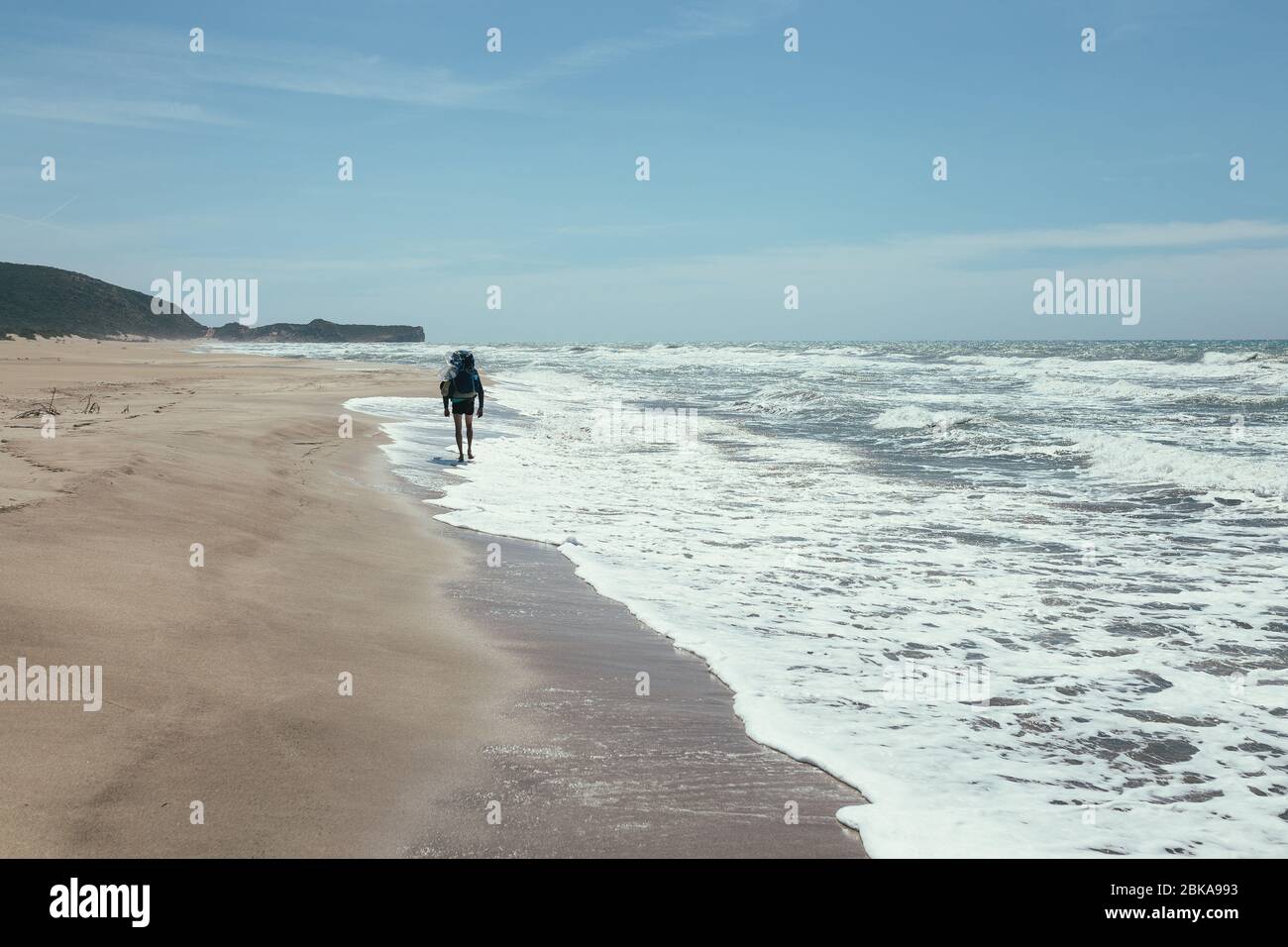 tourist walking on the beach Stock Photo - Alamy
