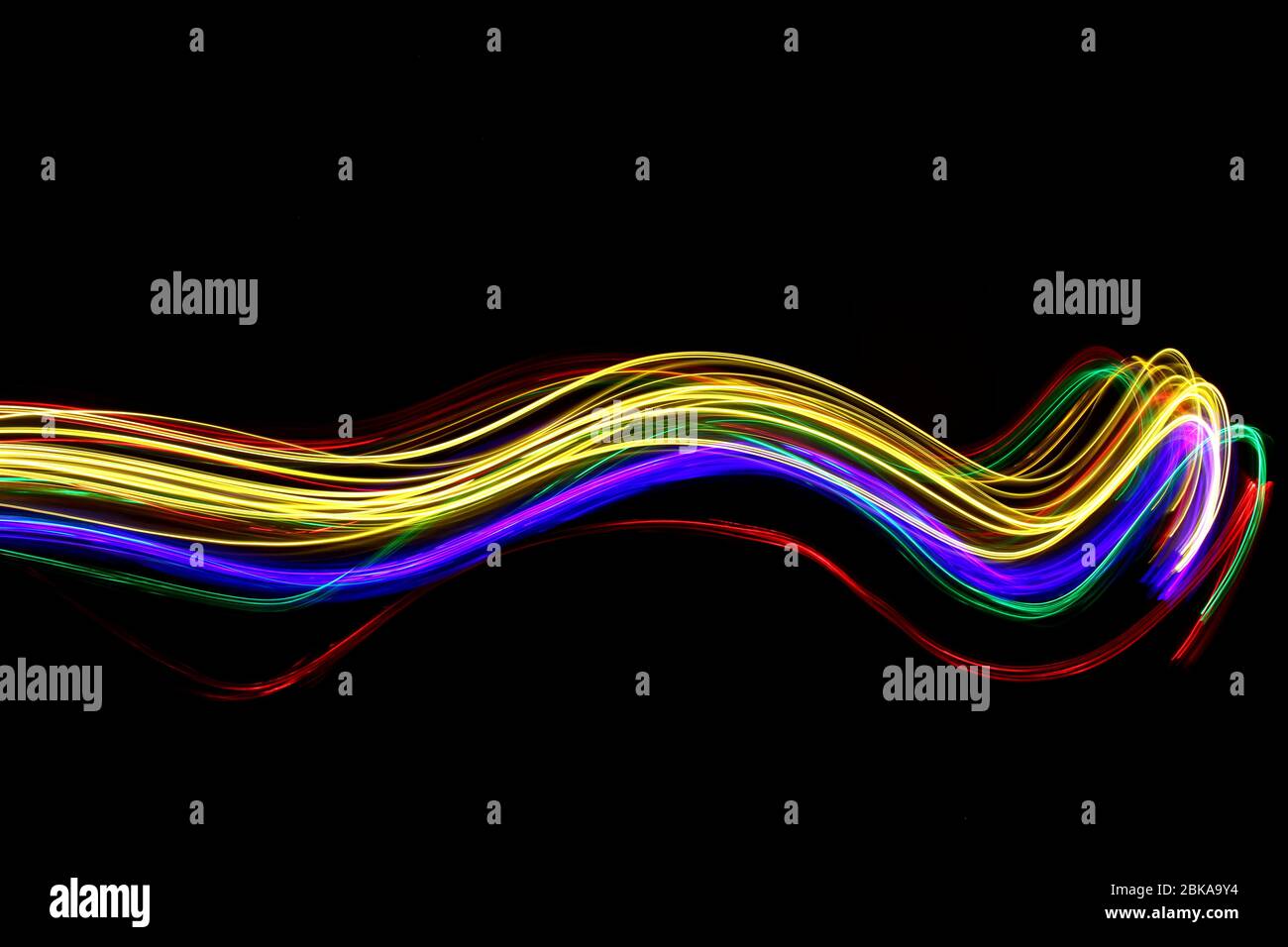 Long exposure photograph of neon colour in an abstract swirl, parallel ...