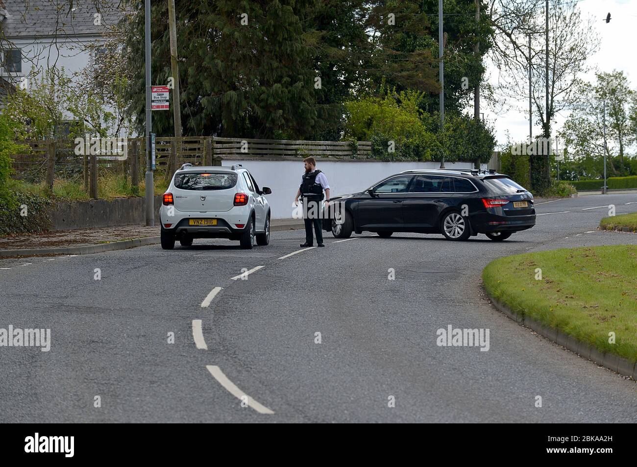 PSNI officers pictured at a vehicle checkpoint, engaging the public on ...