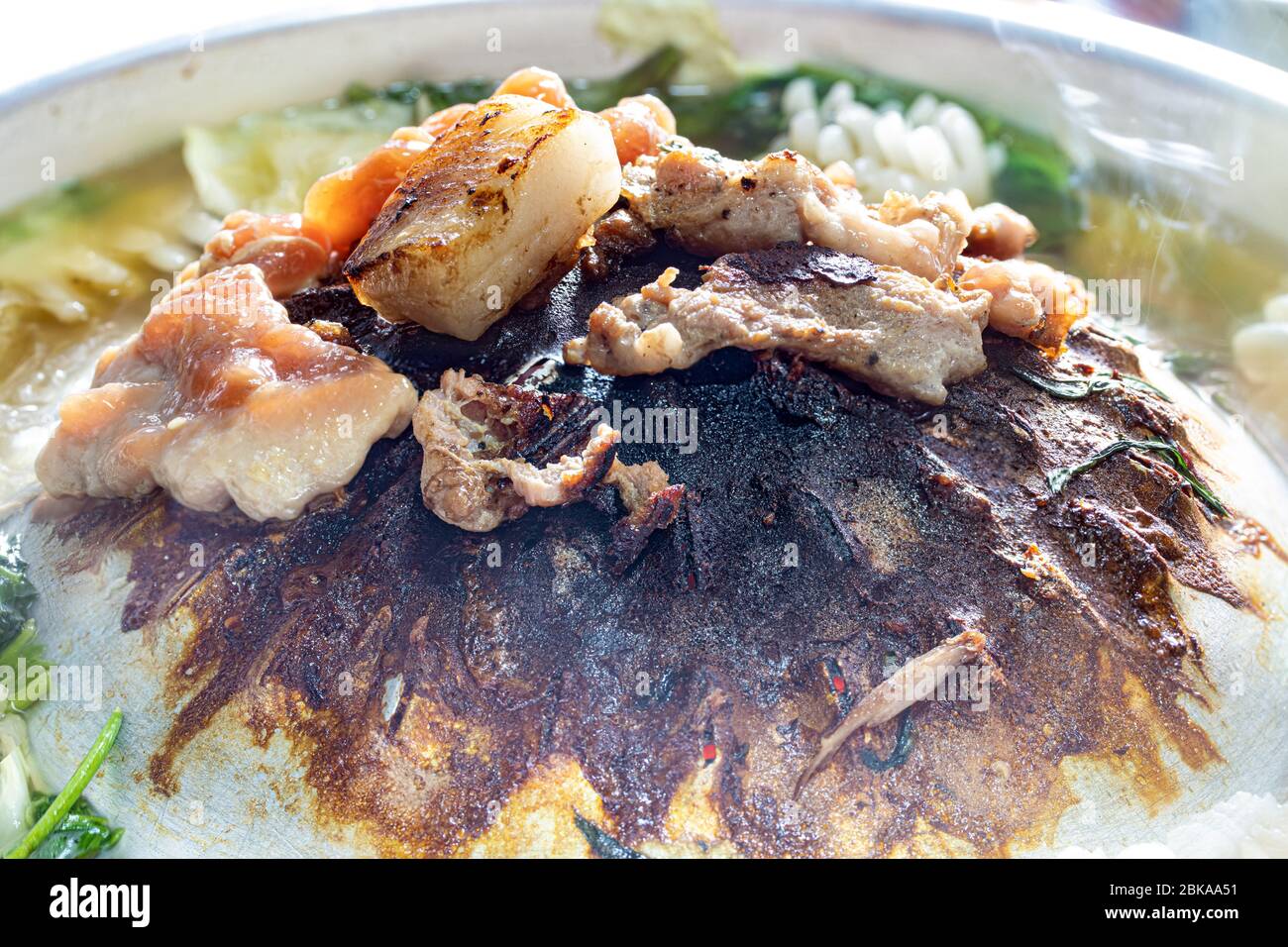 A preparation of roasted meat with sauce of vegetable on Hot Pot - Mu ...