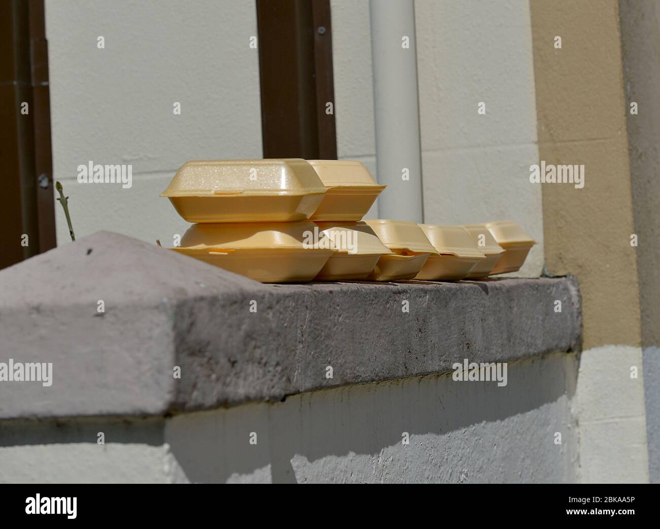 Empty fast food burger containers left on a wall in Londonderry ...