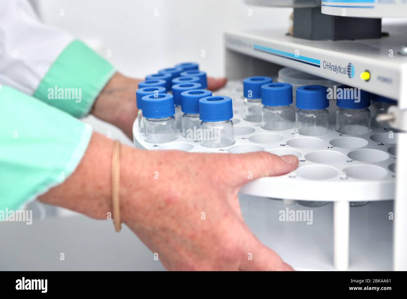 An analyzer with a rotary autosampler at work in a factory. Production ...