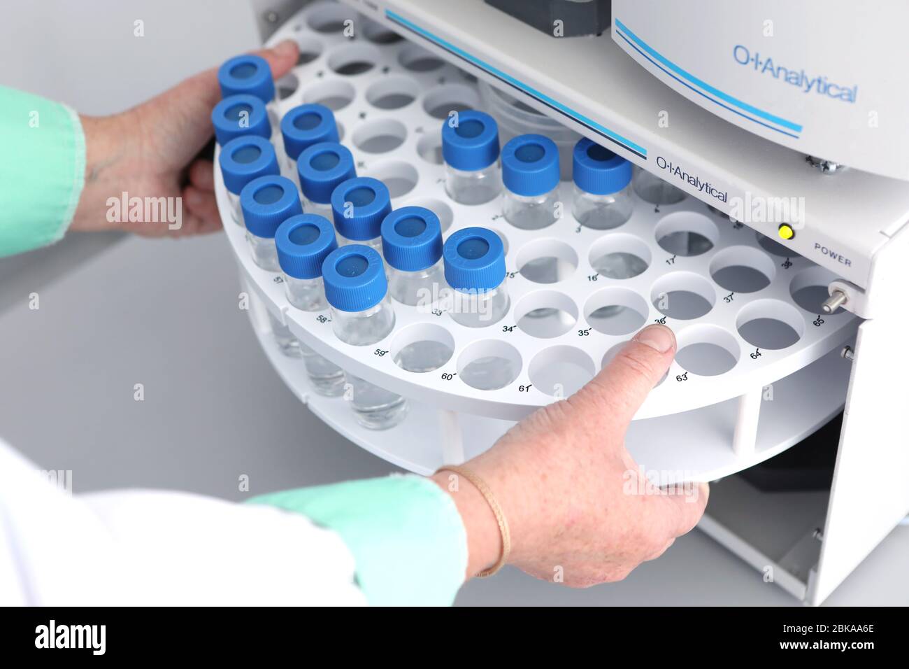 An analyzer with a rotary autosampler at work in a factory. Production ...