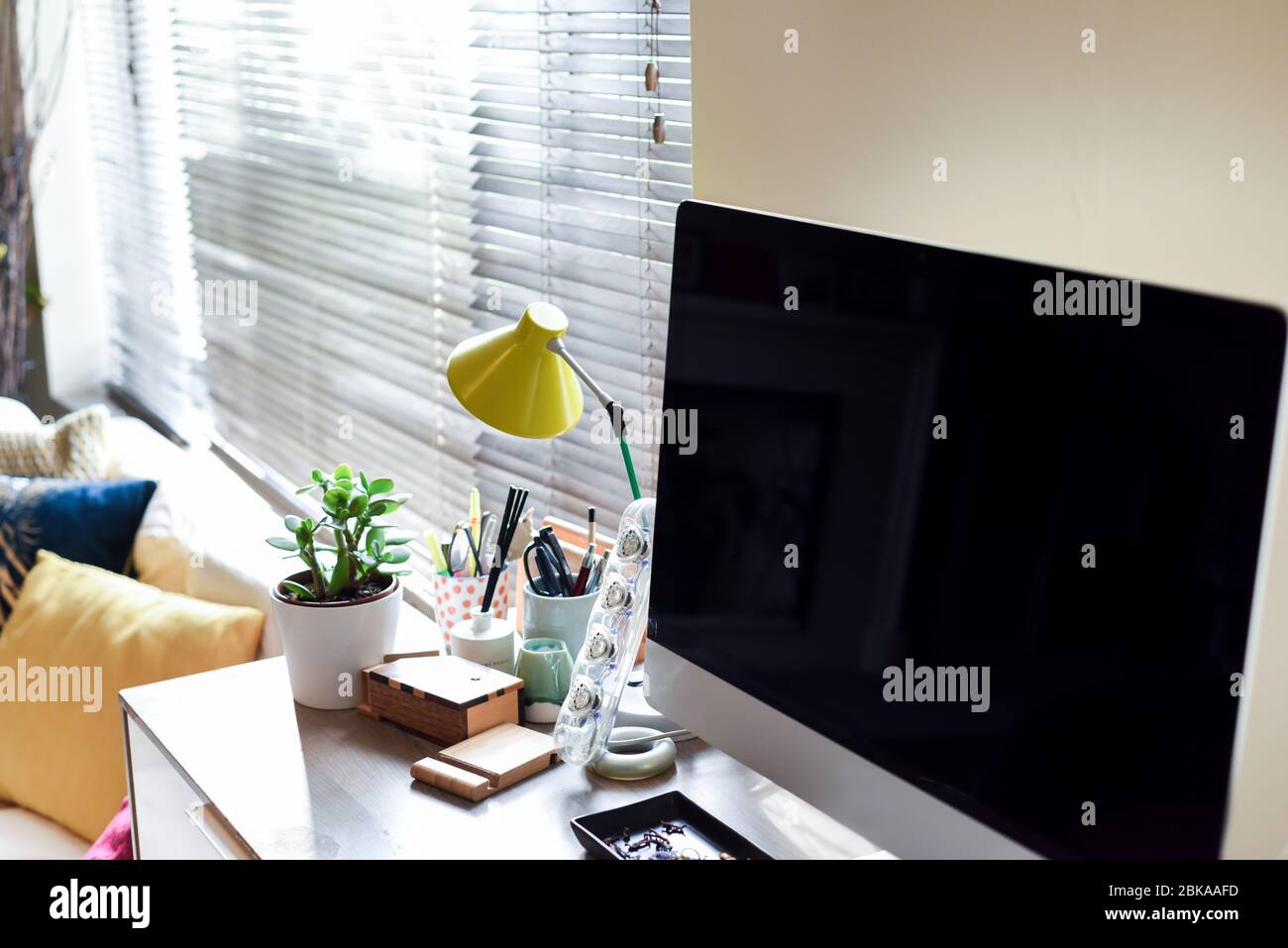 Home working area with office desk set up in living room Stock Photo ...