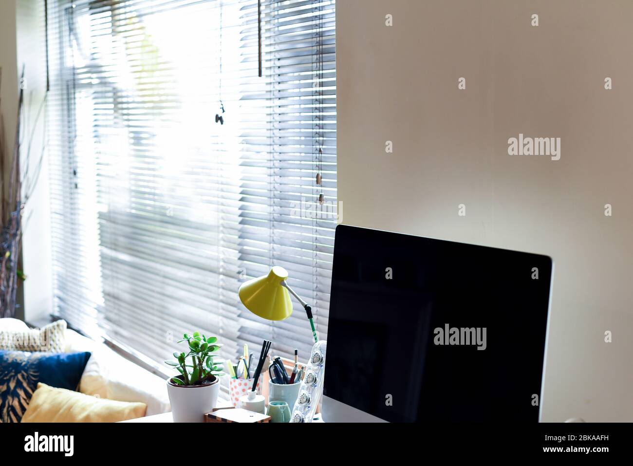 Home working area with office desk set up in living room Stock Photo ...