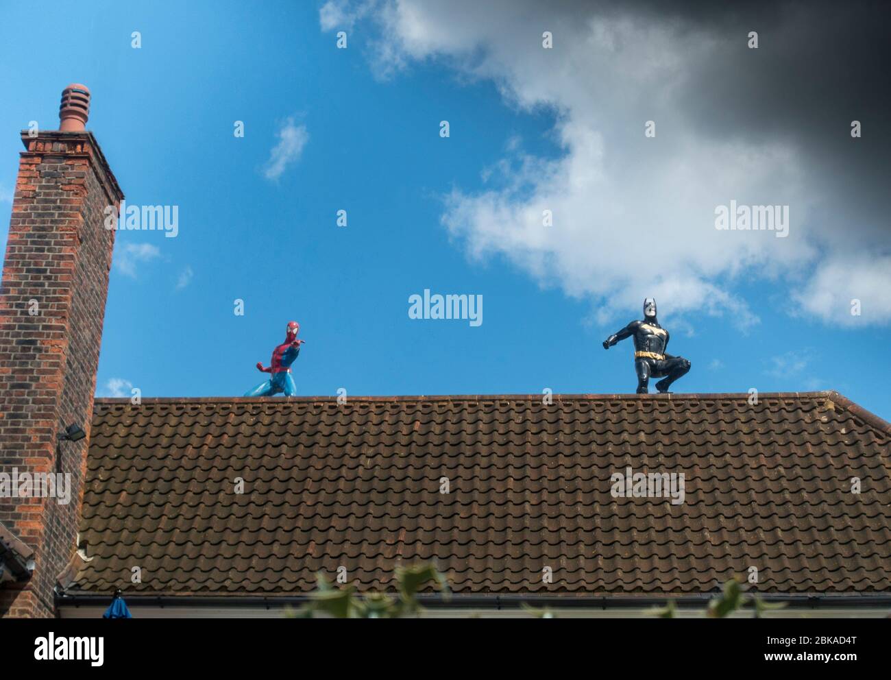 Superheroes On Top Of House Stock Photo - Alamy