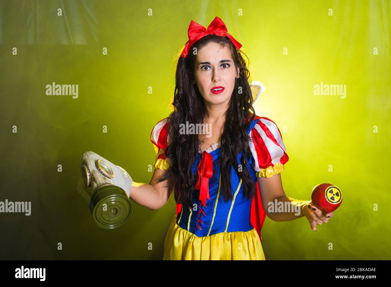 Woman holding hazardous radioactive apple. Nuclear and radiation ...