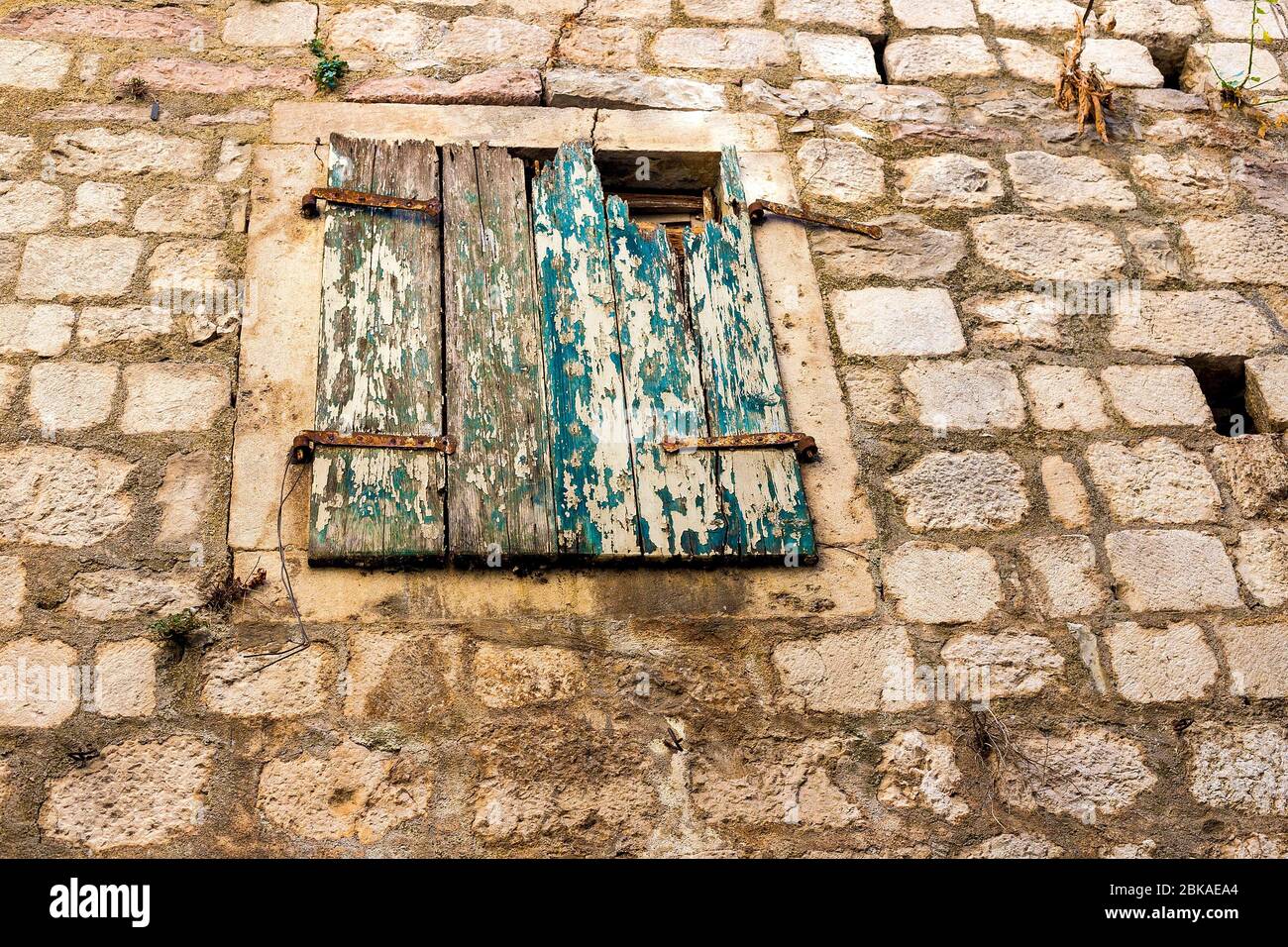 Authentic house with a stone wall, with beautiful old open windows and ...