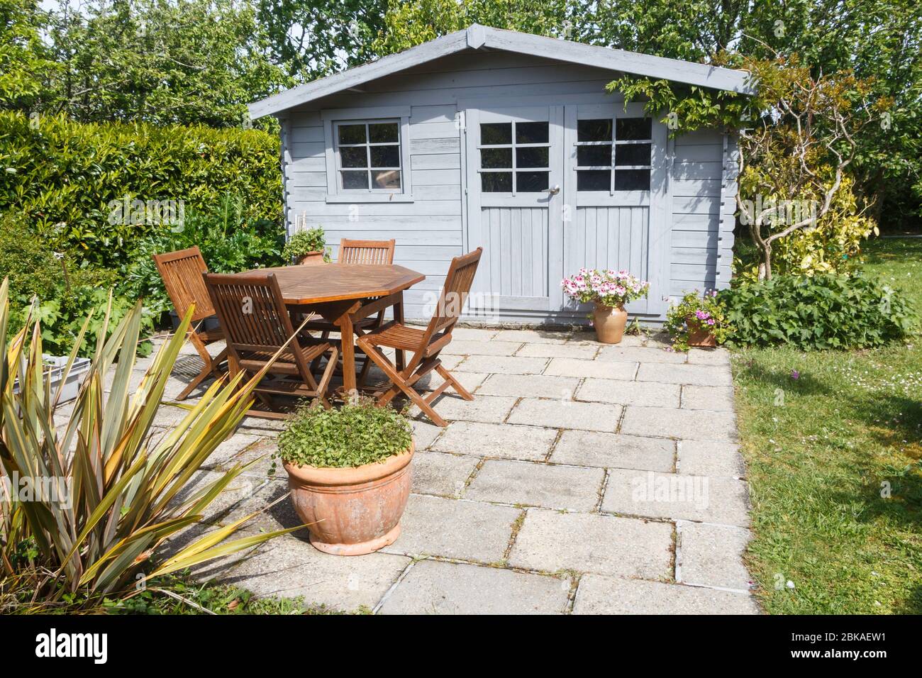Shed with terrace and wooden garden furniture during spring Stock Photo ...