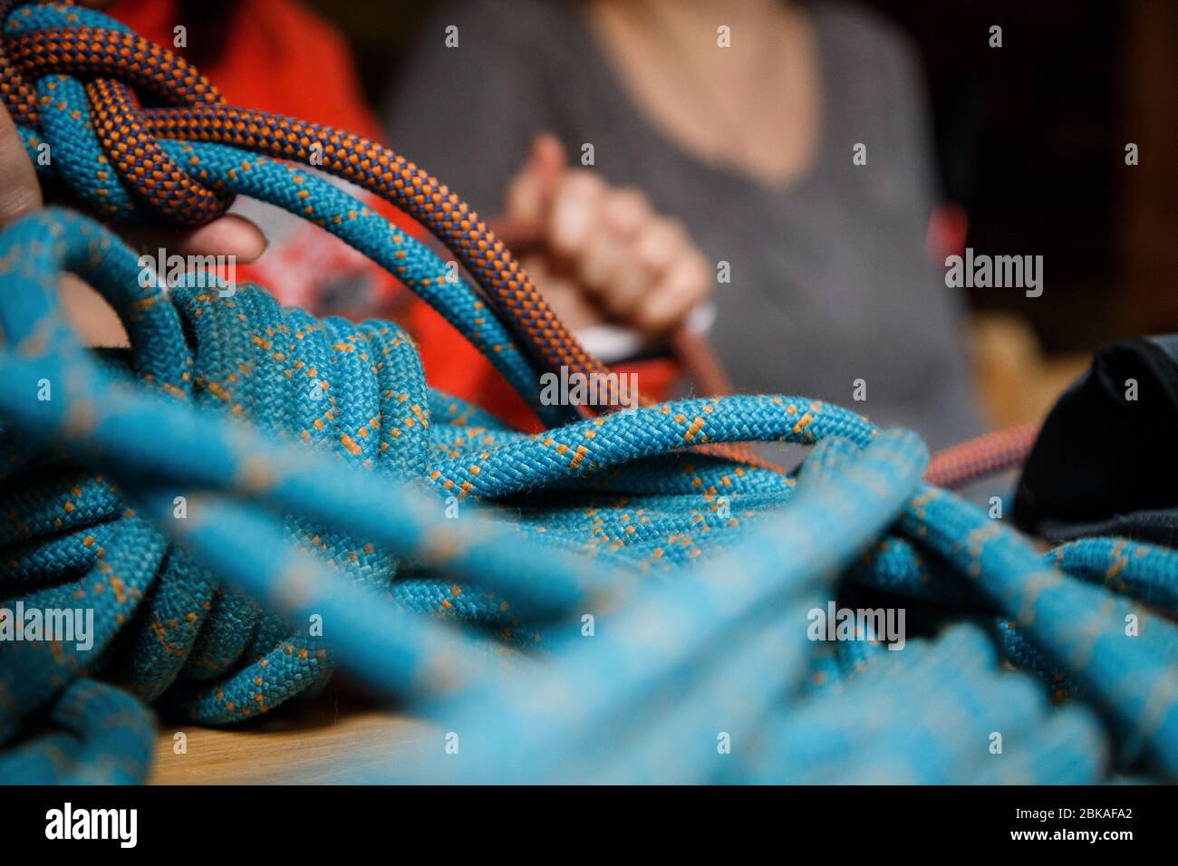 Climbing yellow and blue ropes Stock Photo - Alamy