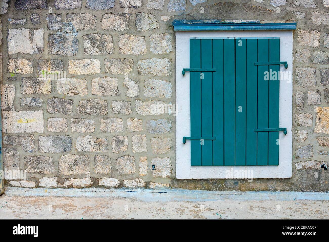 Authentic house with a stone wall, with beautiful old open windows and ...