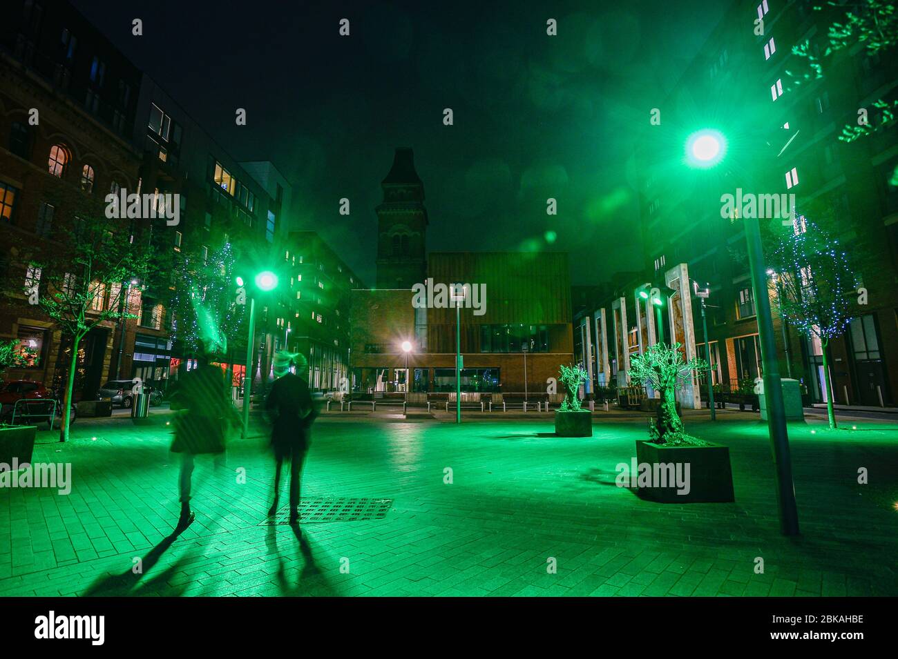 People make their way across Cutting Room Square, Ancoats, Manchester ...
