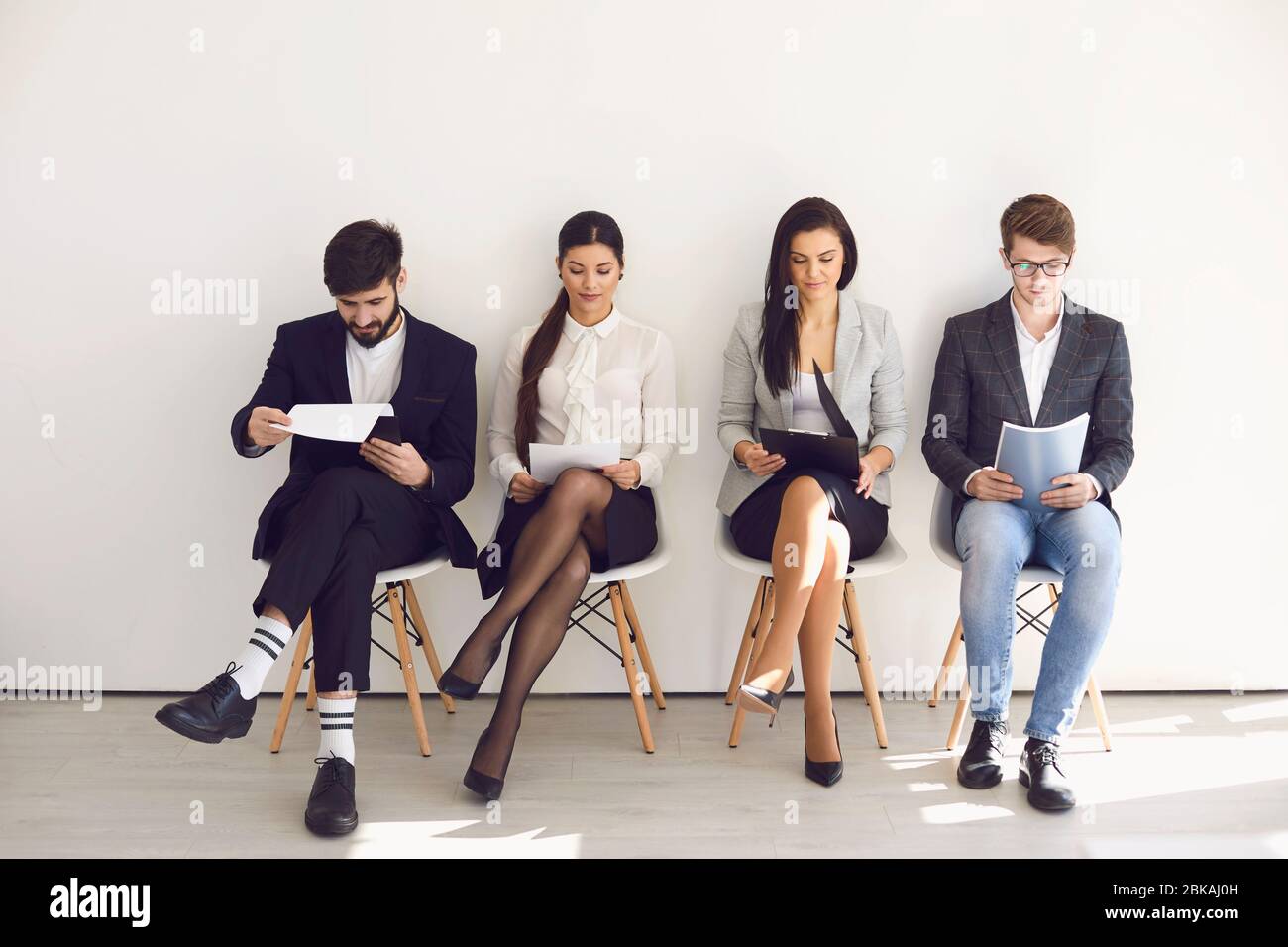 Business people waiting for job interview recruitment sitting on a ...