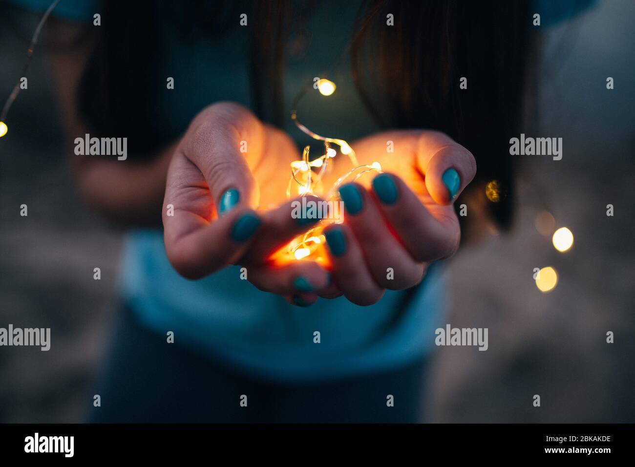 girl with lights in hands Stock Photo - Alamy