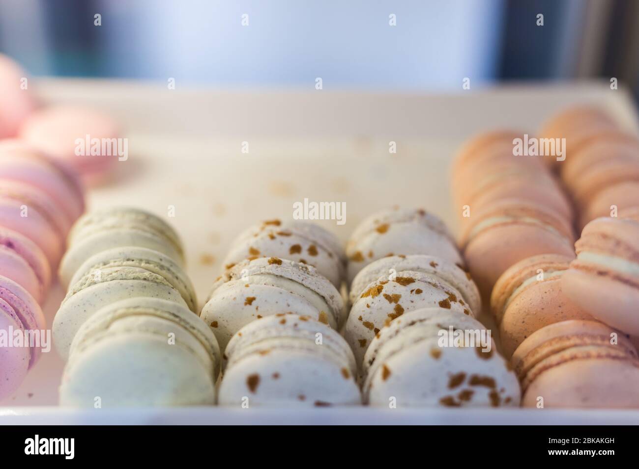 Fresh colored macaroons close-up, sale in coffee shop showcase Stock ...