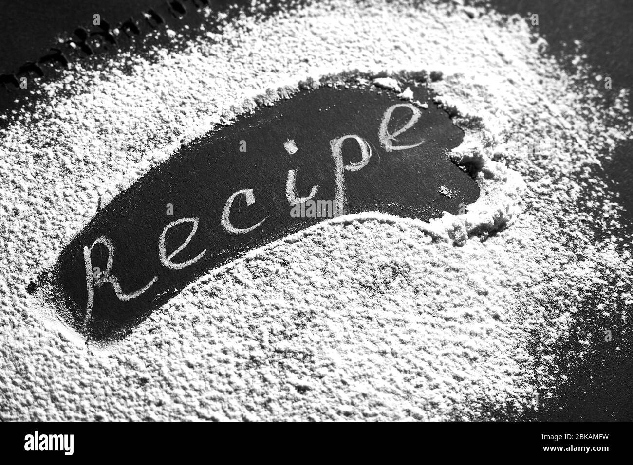 Headline recipe sprinkle flour on a black table. Banner recipe ...