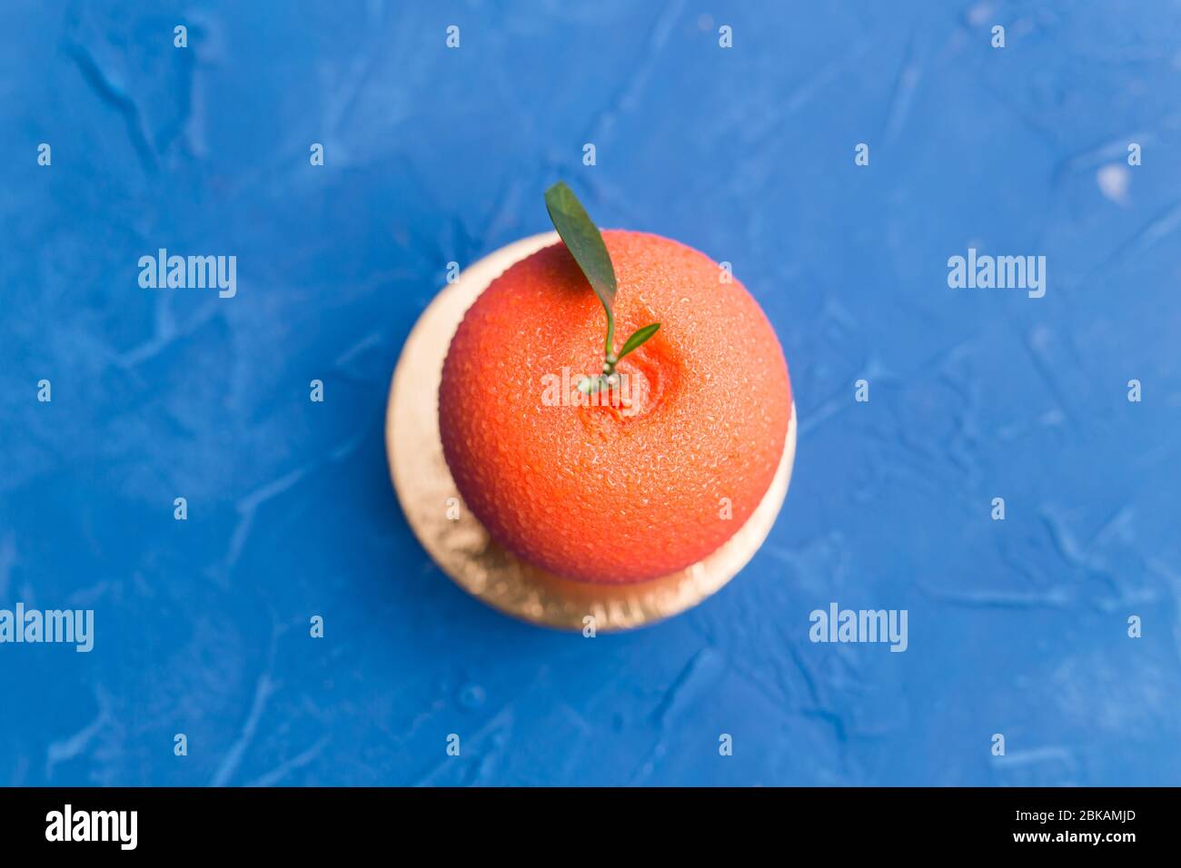 Sweets, cake and dessert concept - Delicious orange cake in orange ...