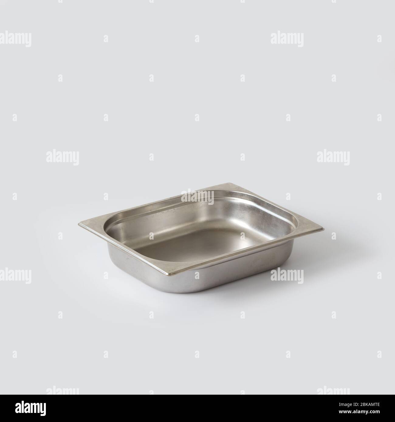 metallic baking pan on white background Stock Photo - Alamy