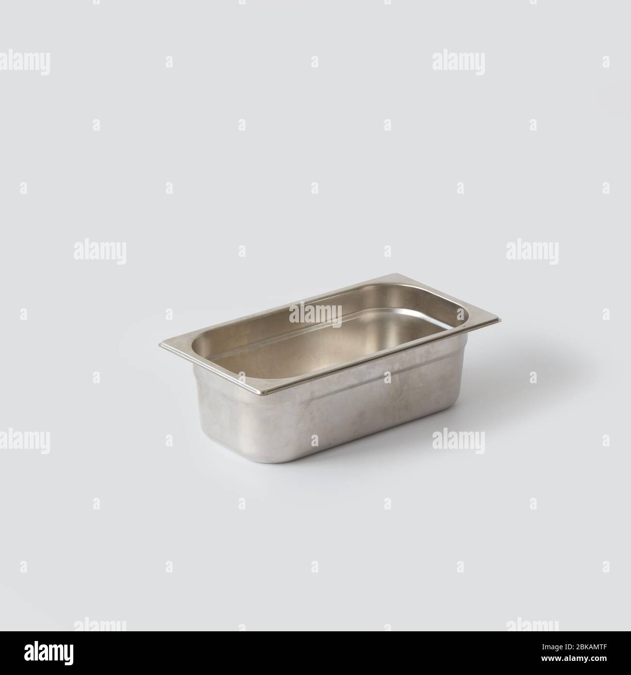 metallic baking pan on white background Stock Photo - Alamy