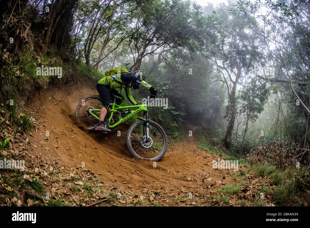 Professional mountain biker Jérôme Clementz rides a dusty corner on ...