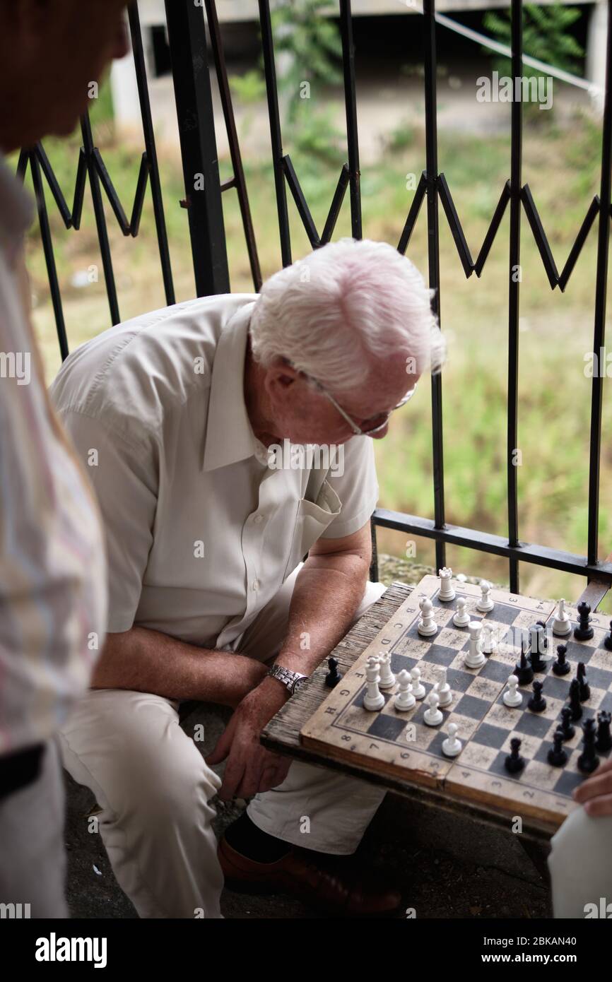 Old men are playing chess in park Stock Photo - Alamy