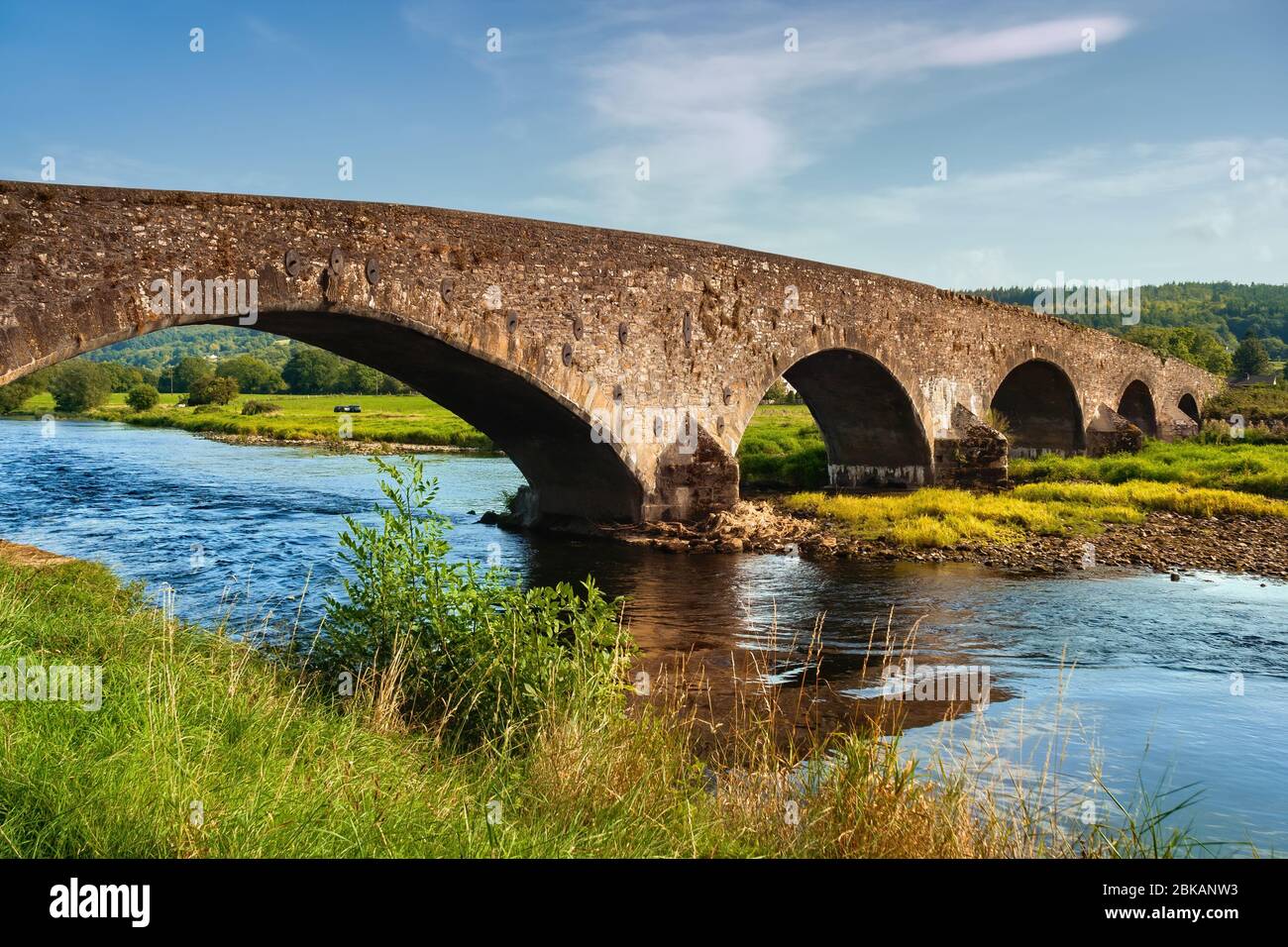Old stone arch bridge over River Suir in County Tipperary, Ireland ...