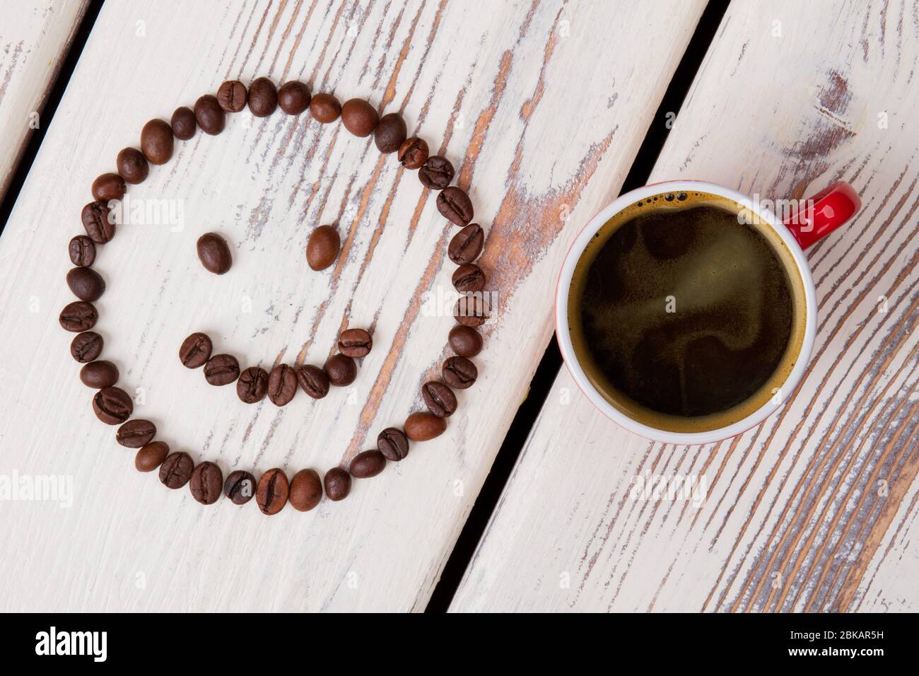 Top view cup of hot coffee and smiley face Stock Photo - Alamy