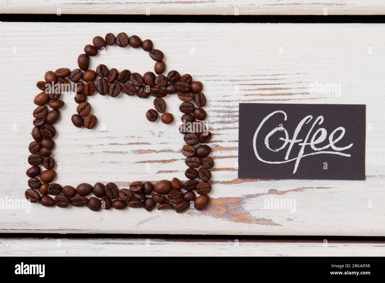Square made of coffee beans on white wood Stock Photo - Alamy