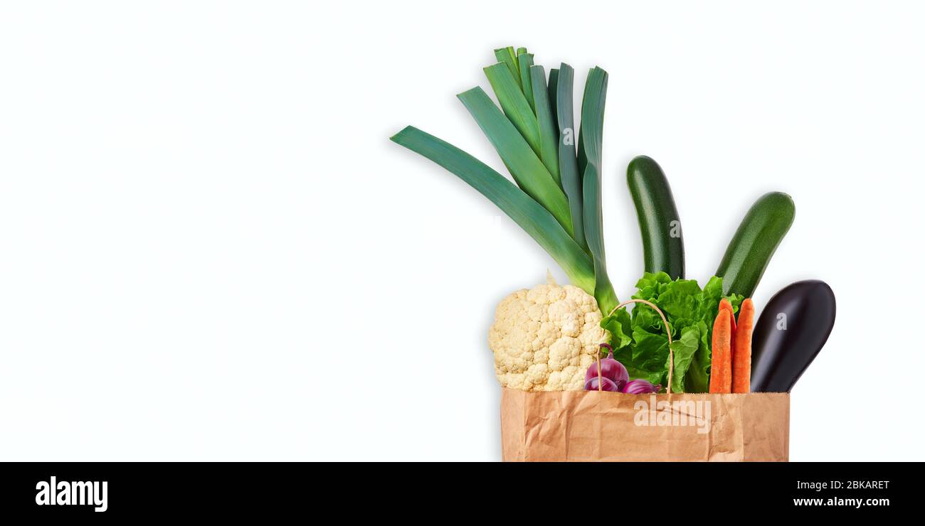 Paper bag with fresh vegetables isolated on white background Stock ...