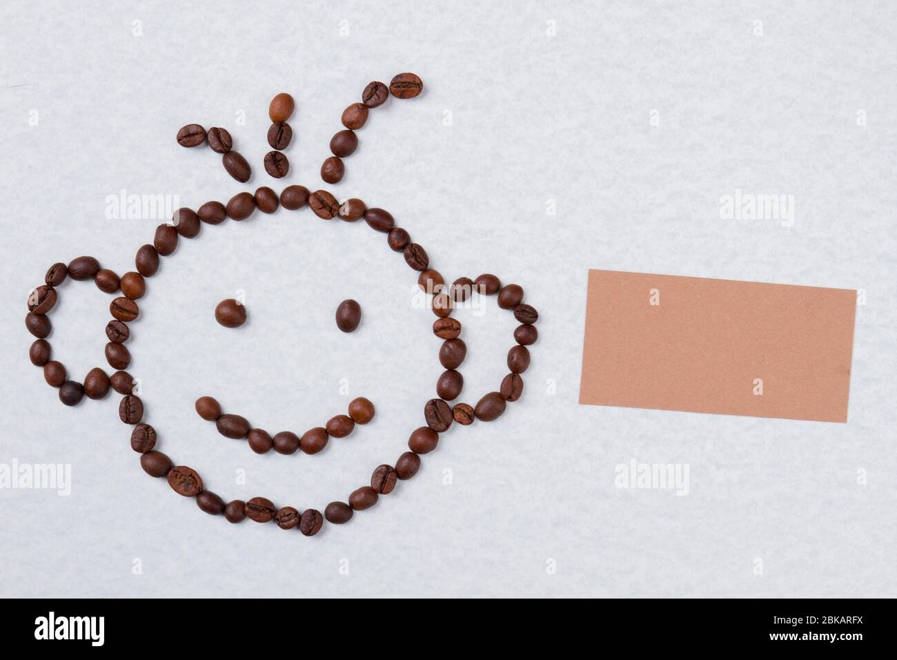 Symbolic coffee bean face of a little boy Stock Photo - Alamy