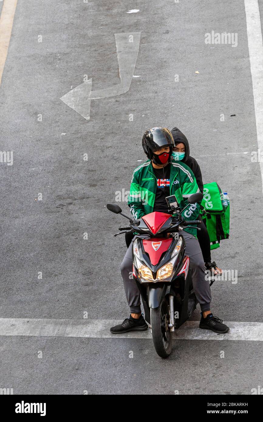 Thai Grab motorcycle rider with face mask during Covid 19 pandemic ...