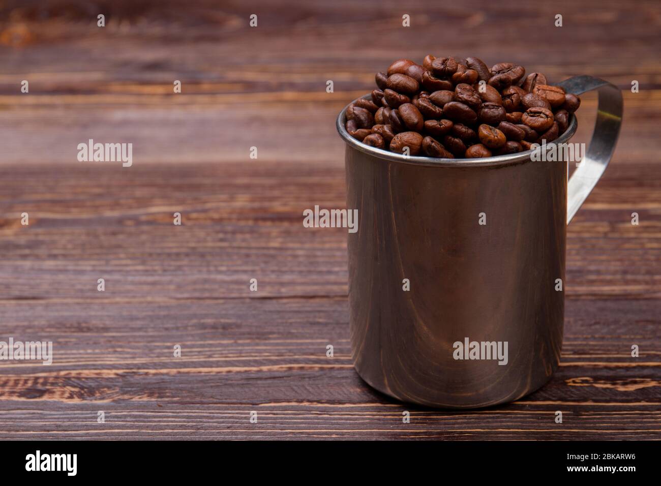 Steel mug overfilled with cup Stock Photo - Alamy