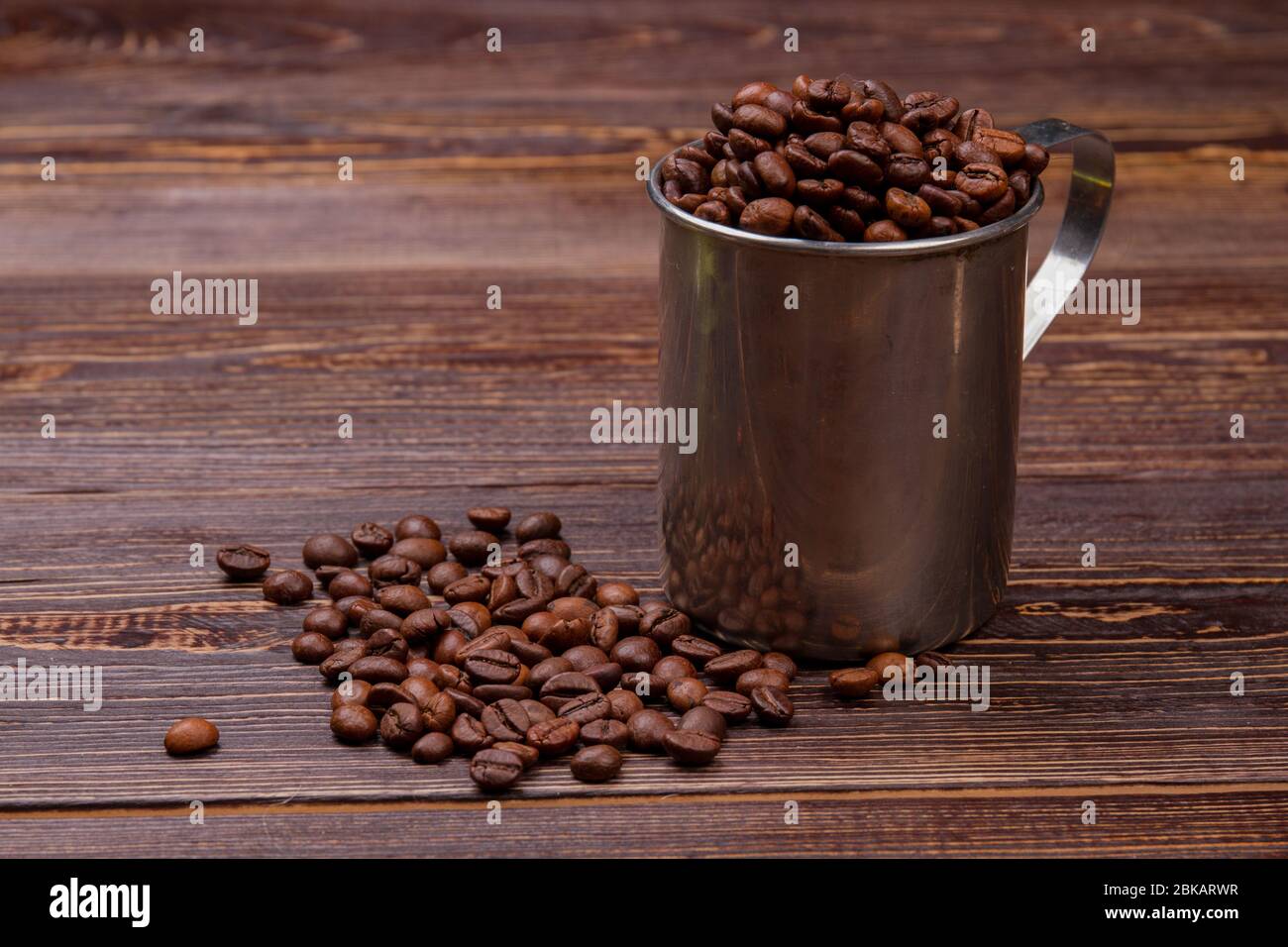 Silver coffee pot filled with coffee beans Stock Photo - Alamy