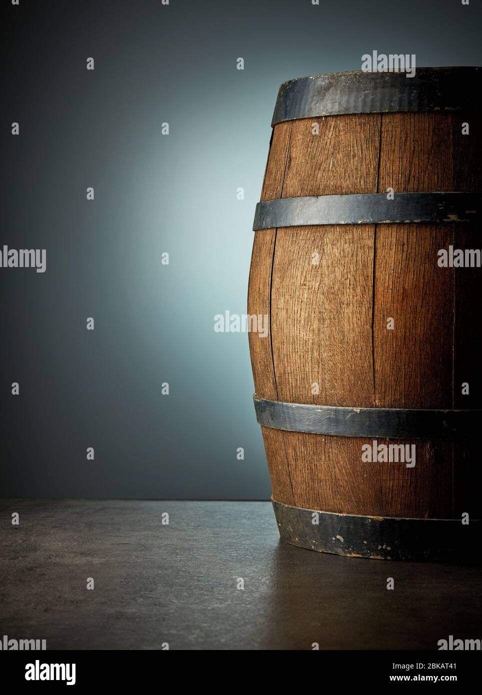 old wooden barrel on grey background Stock Photo - Alamy
