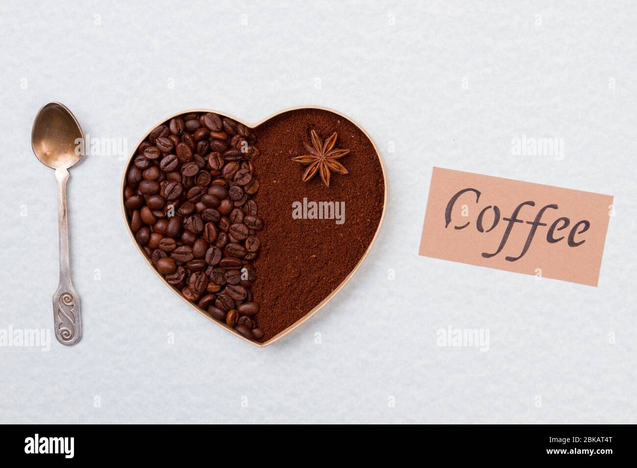 Heart made of coffee beans with instant coffee and teaspoon Stock Photo ...