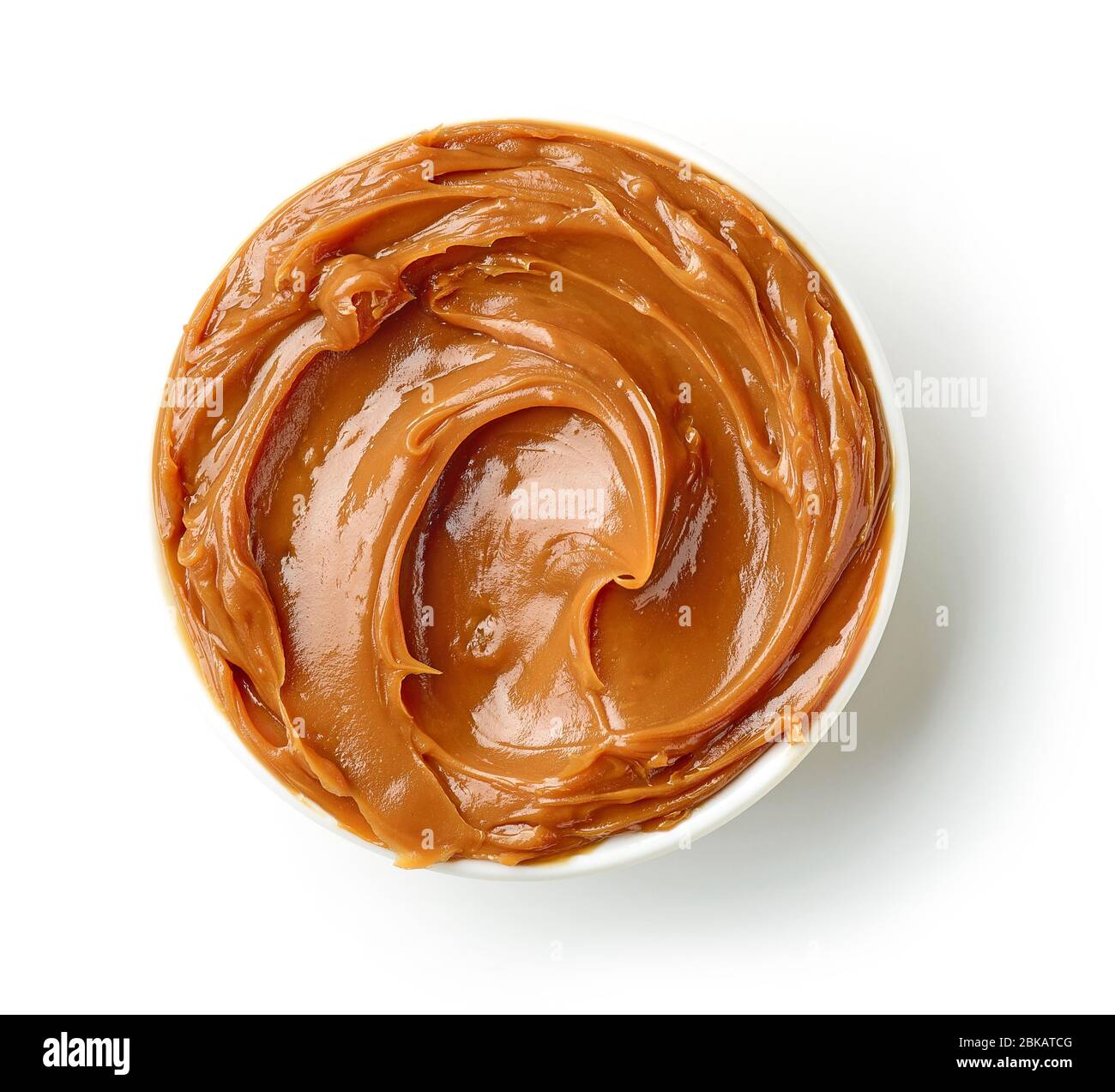 bowl of melted caramel isolated on white background, top view Stock ...