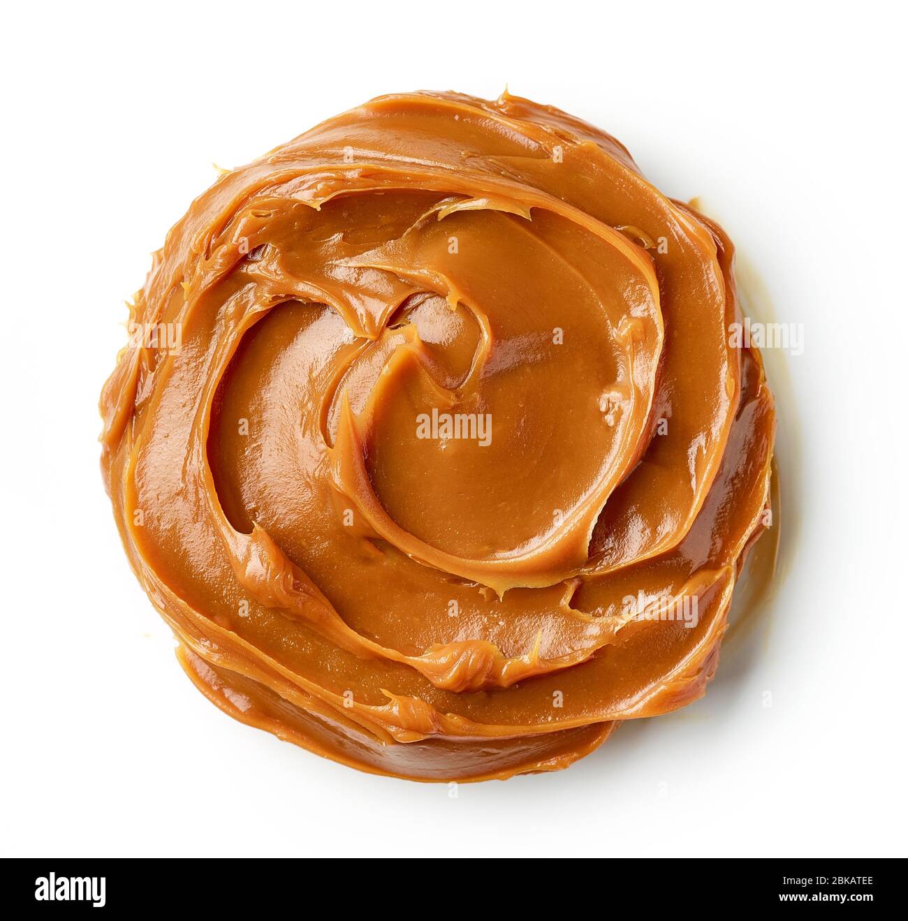 melted caramel isolated on a white background, top view Stock Photo - Alamy