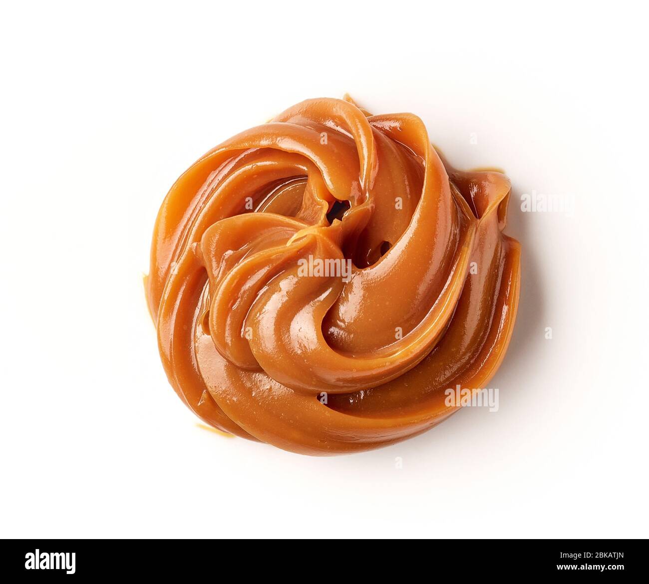 melted caramel isolated on a white background, top view Stock Photo - Alamy