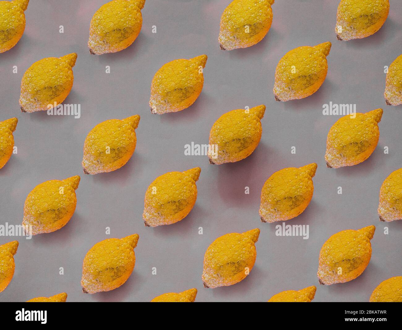 Rotten lemon pattern on grey background Stock Photo - Alamy
