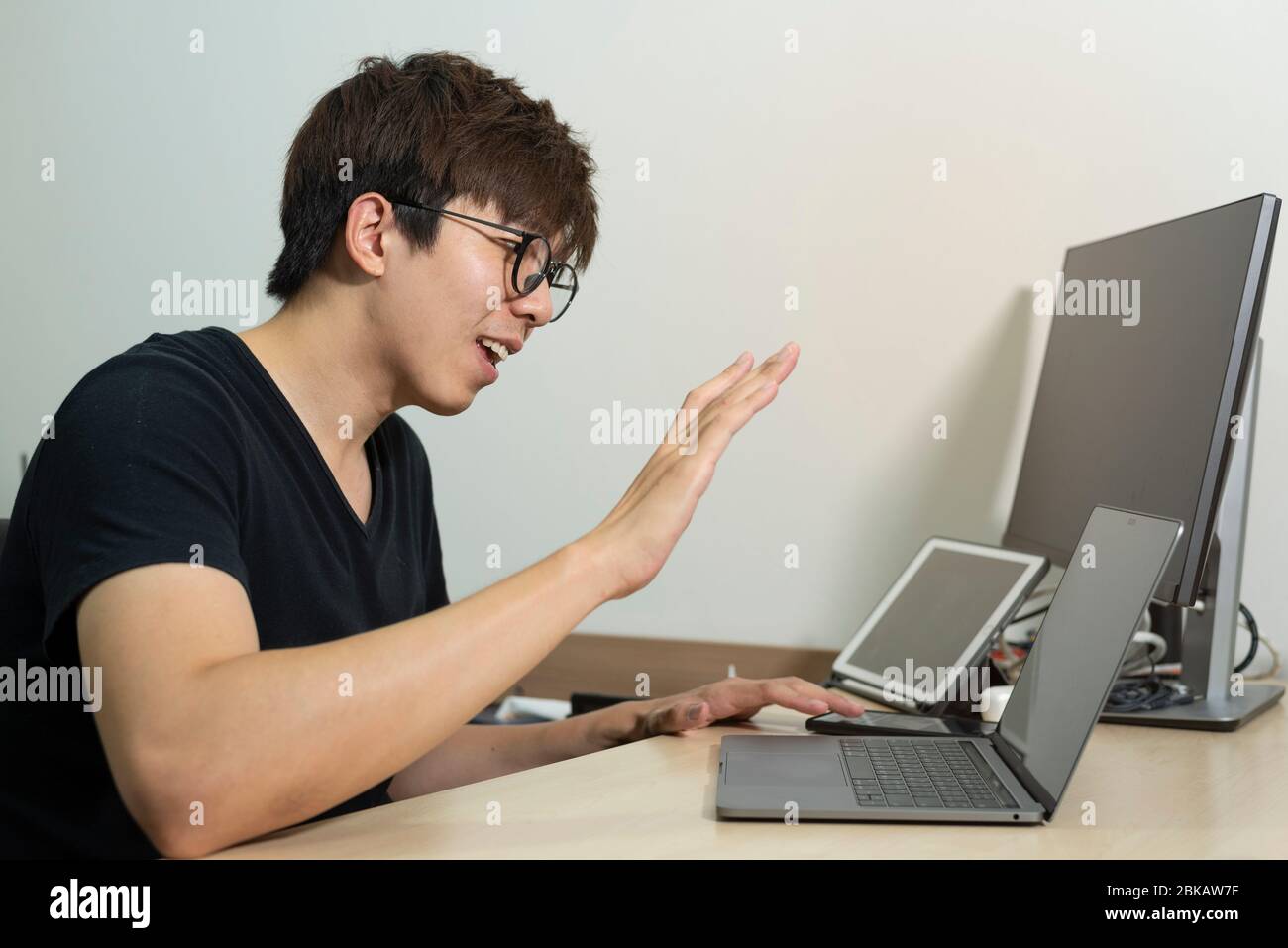 Asian officer man work from home. Man work in action at home. Man with ...