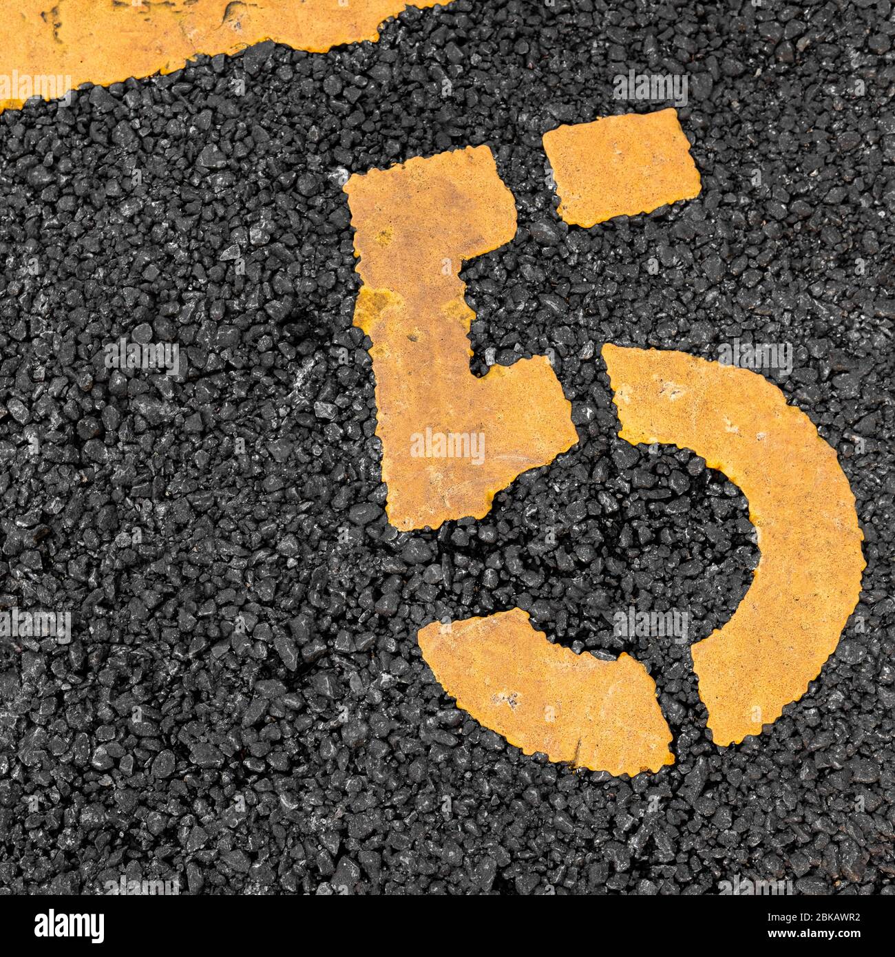 Asphalt parking lot with yellow lot line and yellow lot number 5, five ...