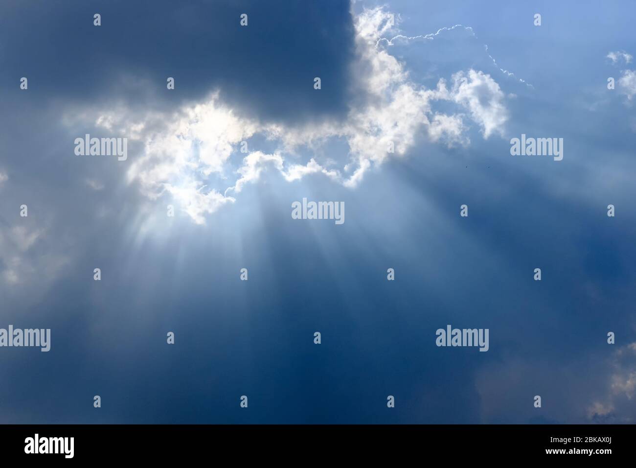 Sunbeam, sunlight through the haze, cloud on the blue sky . Cloud with ...