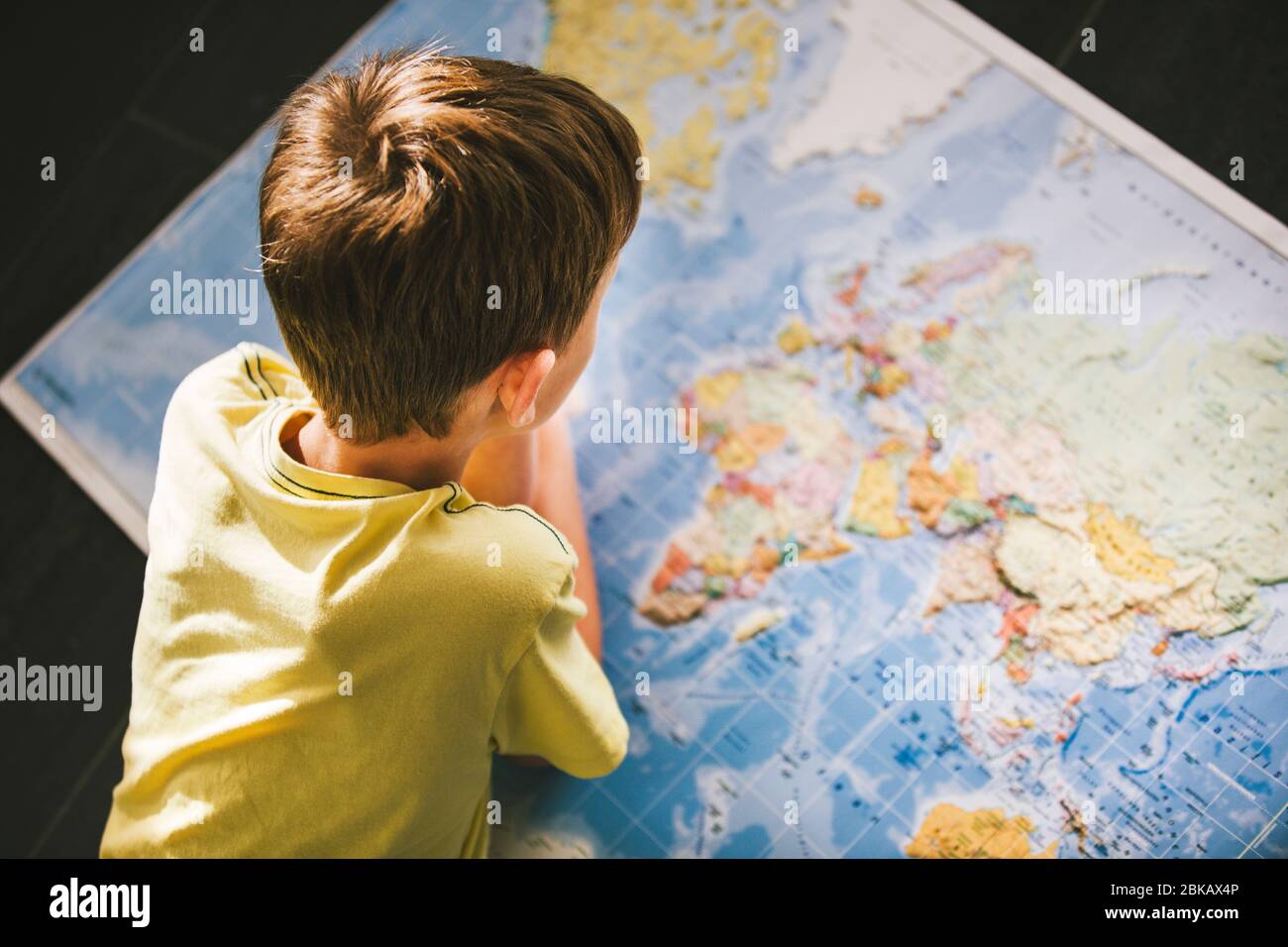 Boy dreaming with map hi-res stock photography and images - Alamy