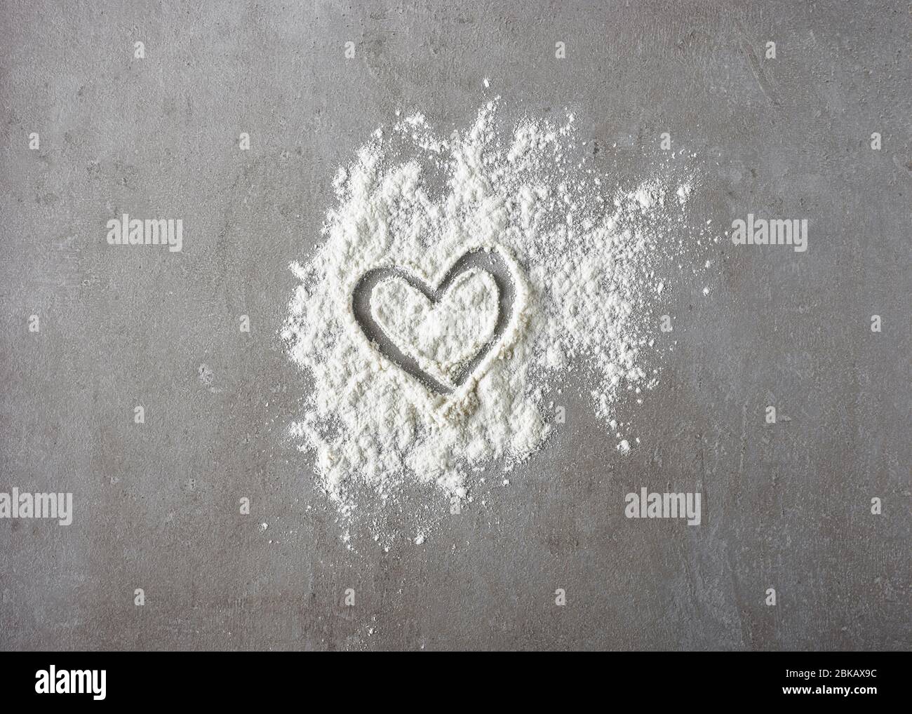 heart shape in flour on grey kitchen table background, top view Stock ...